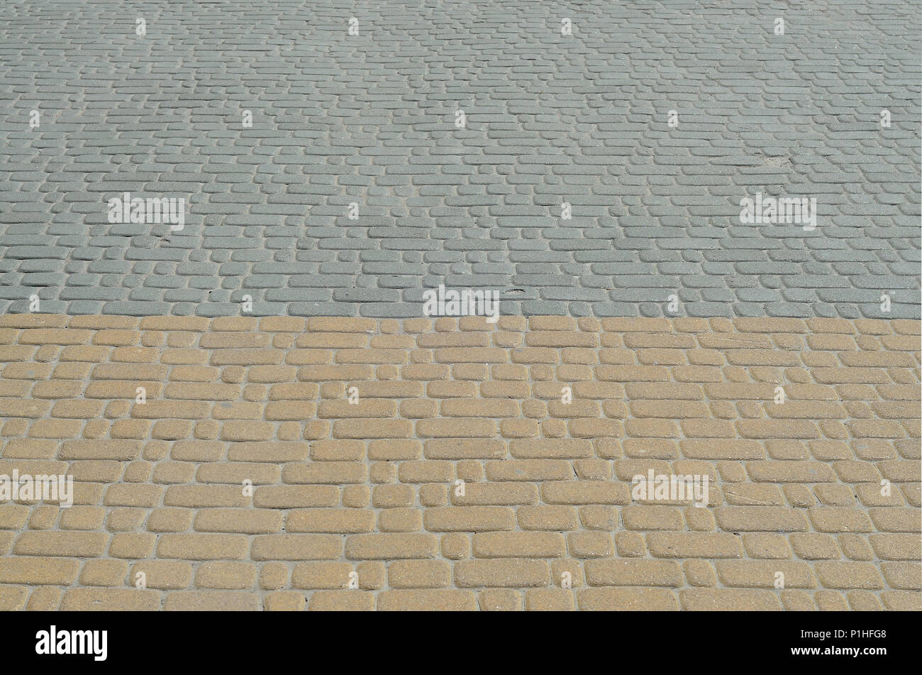 A detailed photo of the square, laid out of modern paving stone with ...