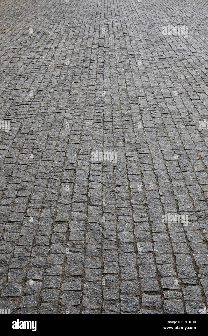 The texture of the paving slab (paving stones) of many small stones of ...