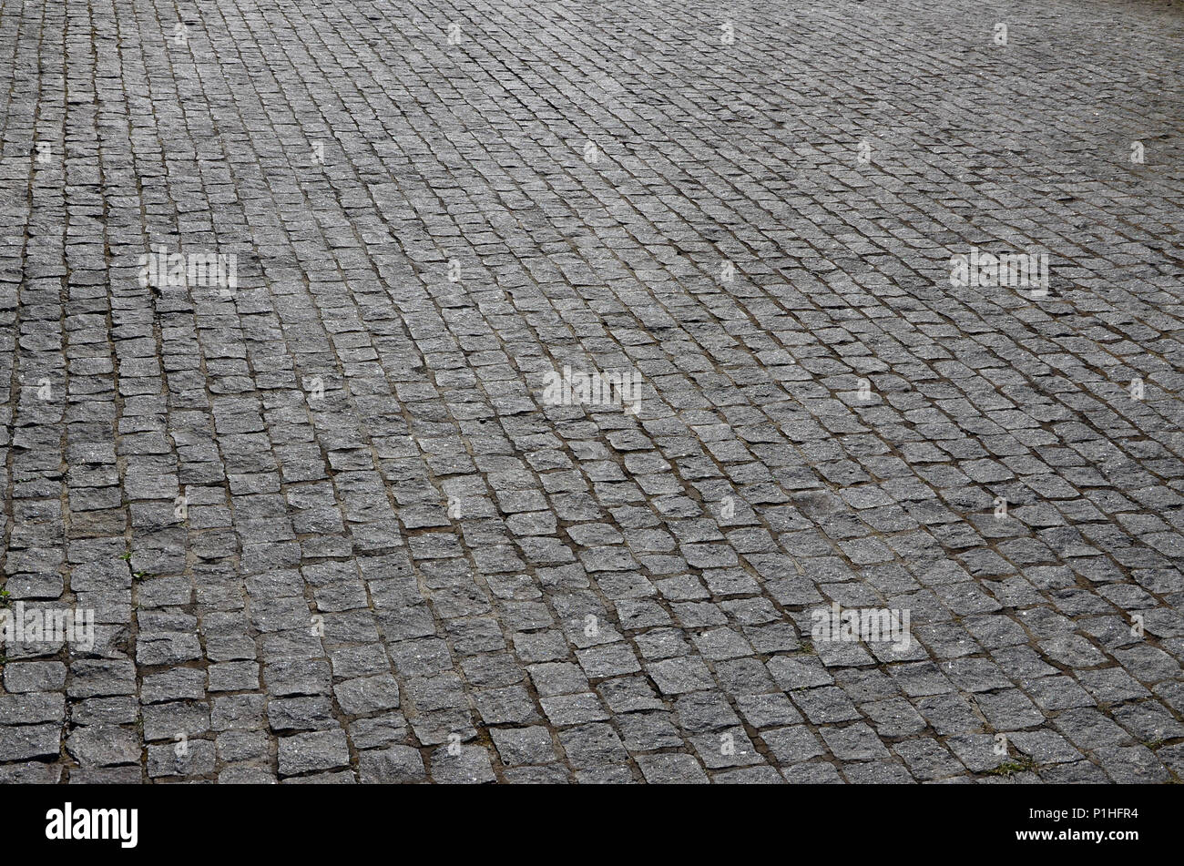 The texture of the paving slab (paving stones) of many small stones of ...