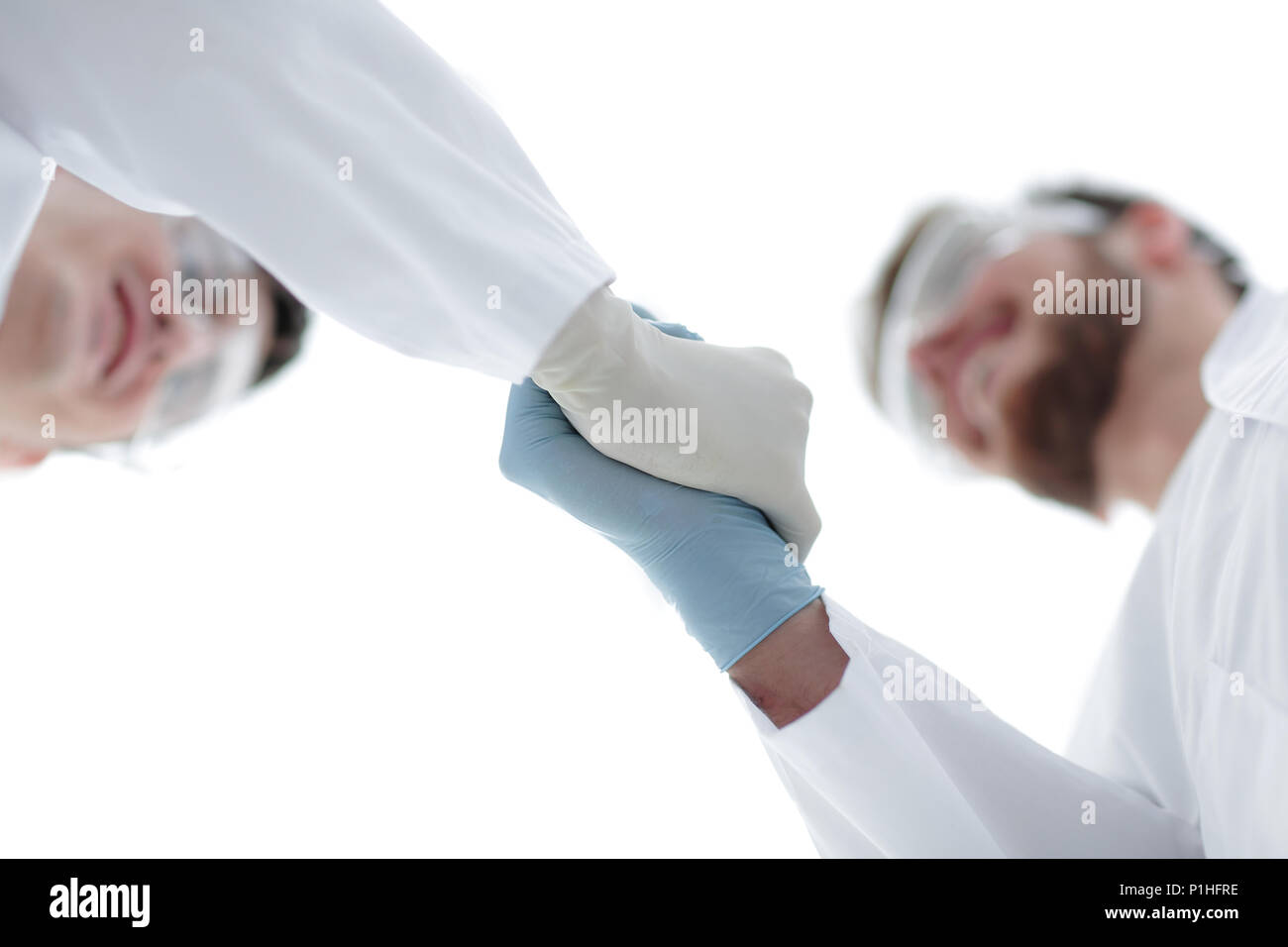 two scientist Shake hands after test completed Stock Photo - Alamy