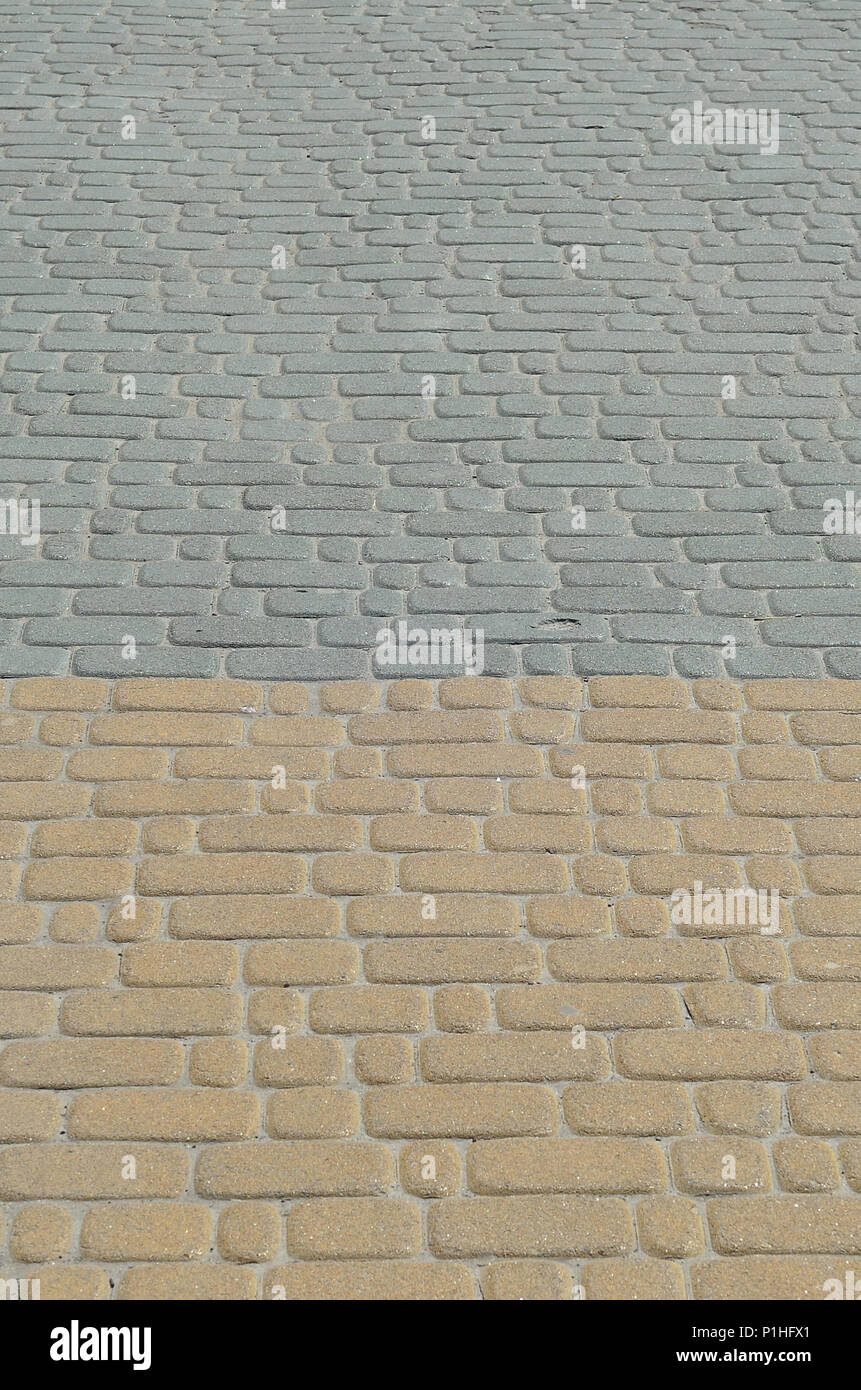 A detailed photo of the square, laid out of modern paving stone with ...