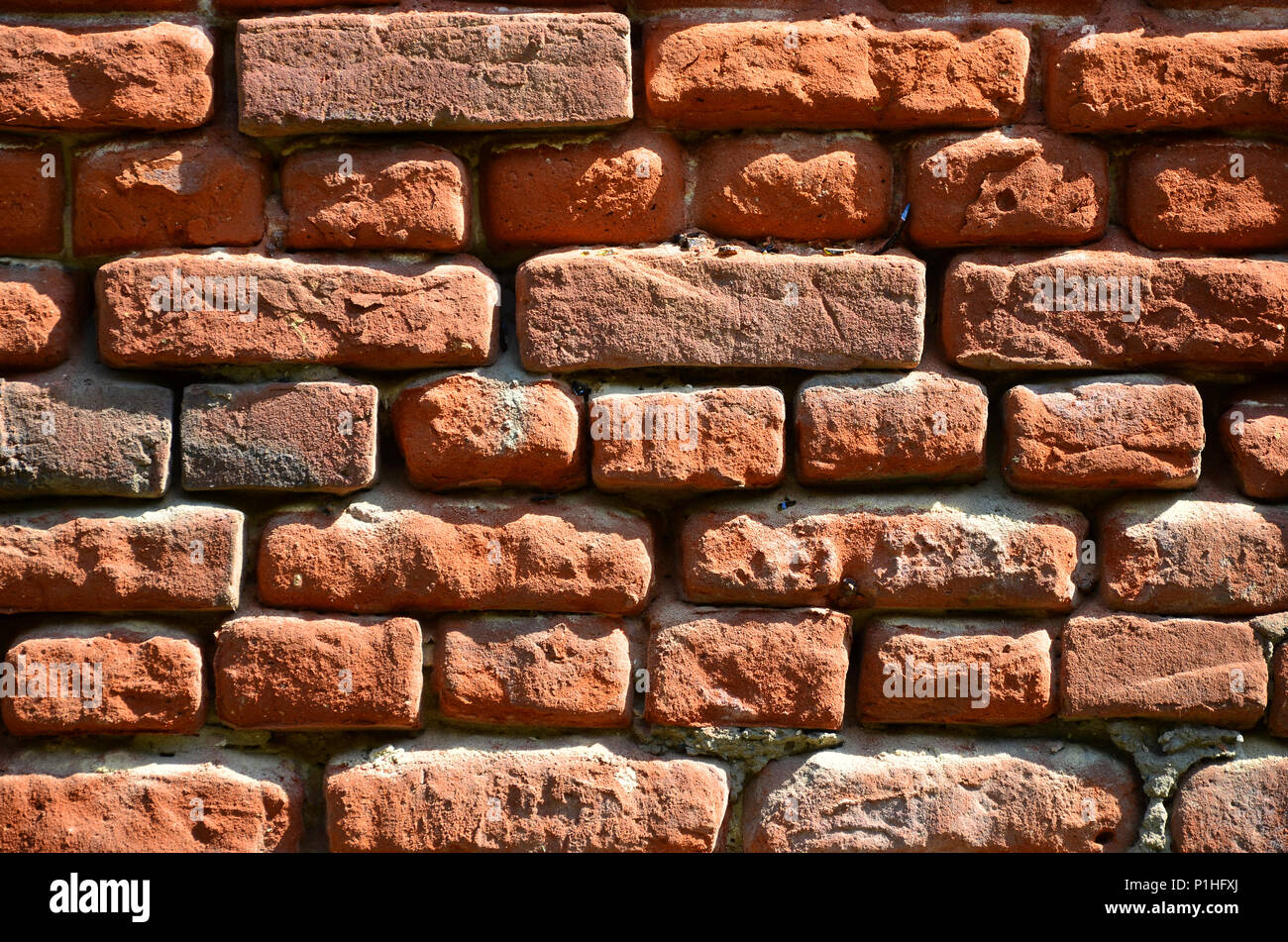 Horizontal wall texture of several rows of very old brickwork made of ...