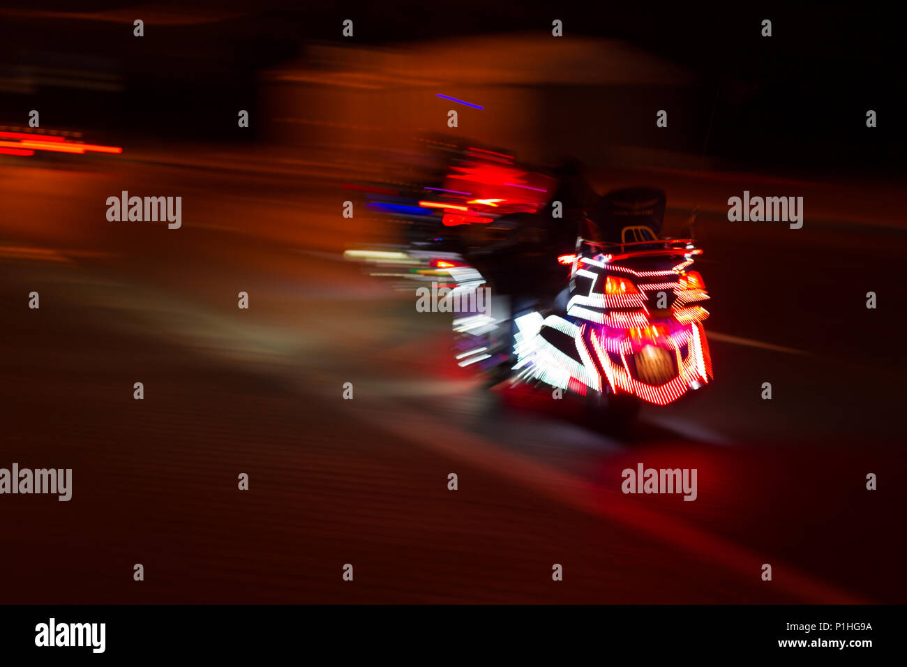 Blurred background riding a motorcycle. Motion bike in multi-colored ...