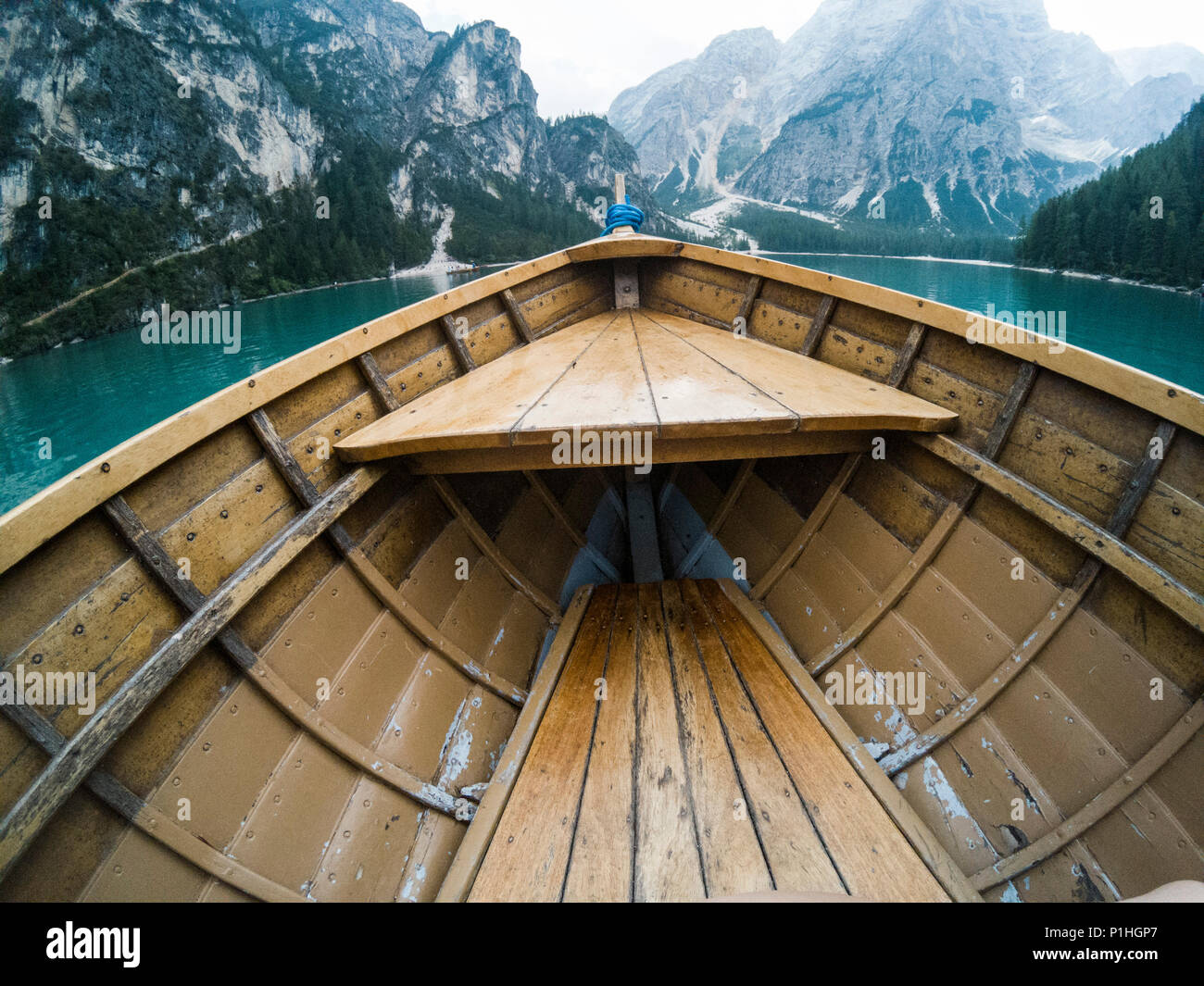 Wooden boat at the alpine mountain lake. Lago di Braies, Dolomites Alps ...