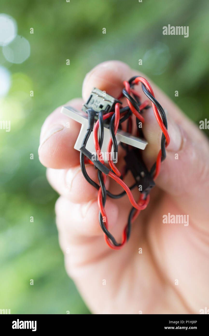 Hand holding electrical wires hi-res stock photography and images - Alamy