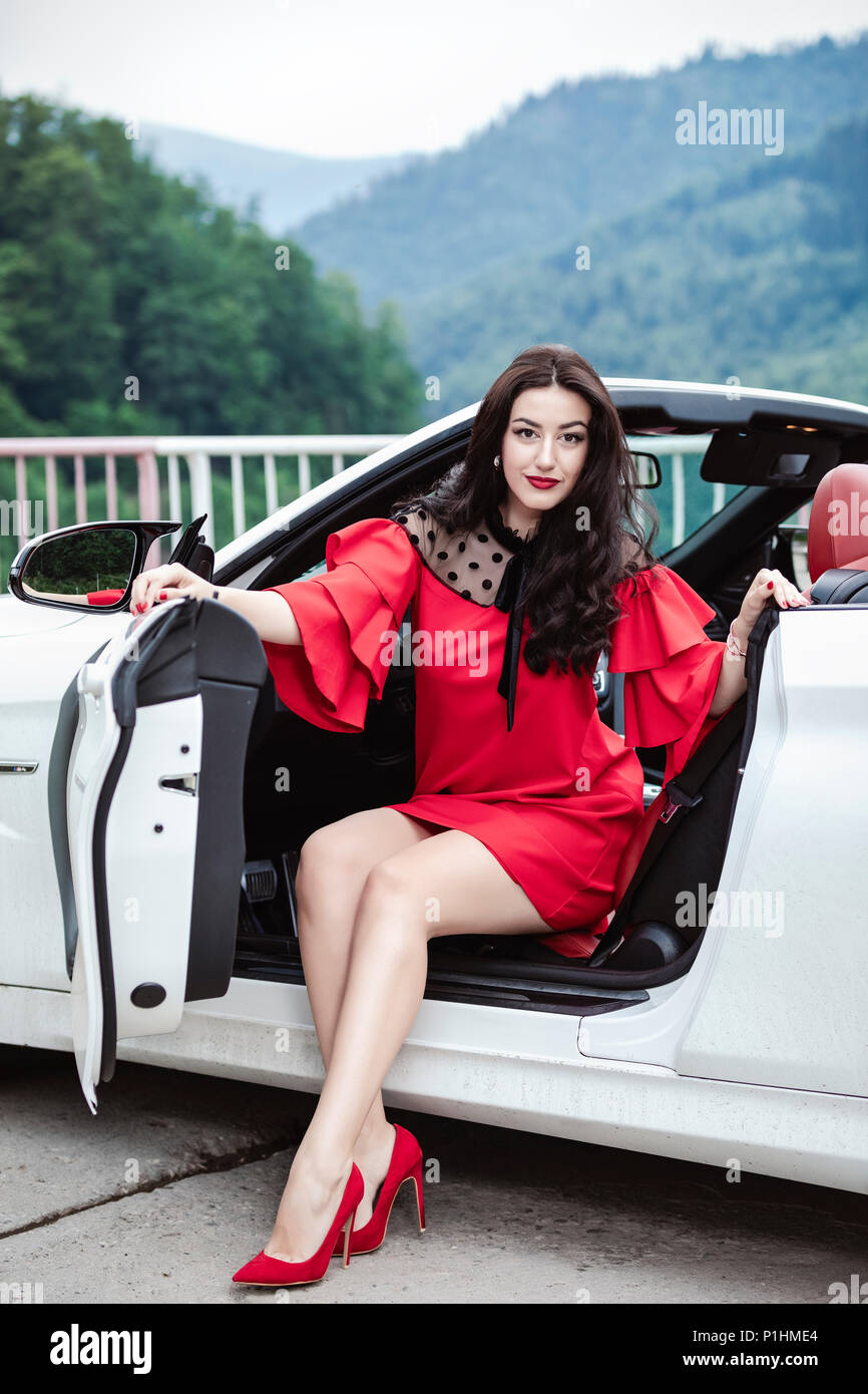 Beautiful young woman in a convertible car enjoying a summer day Stock ...