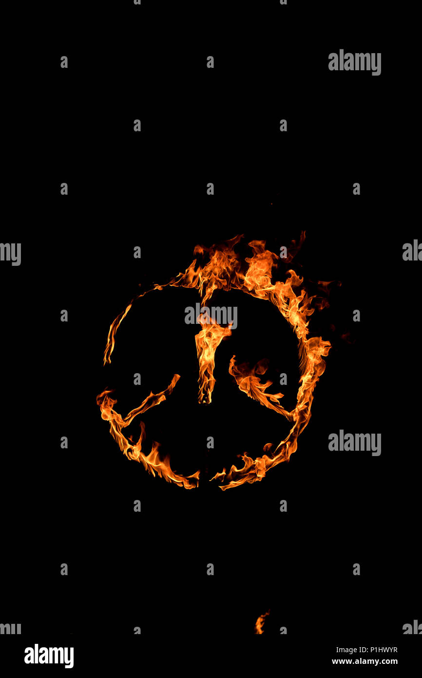 Burning peace symbol over black background Stock Photo - Alamy