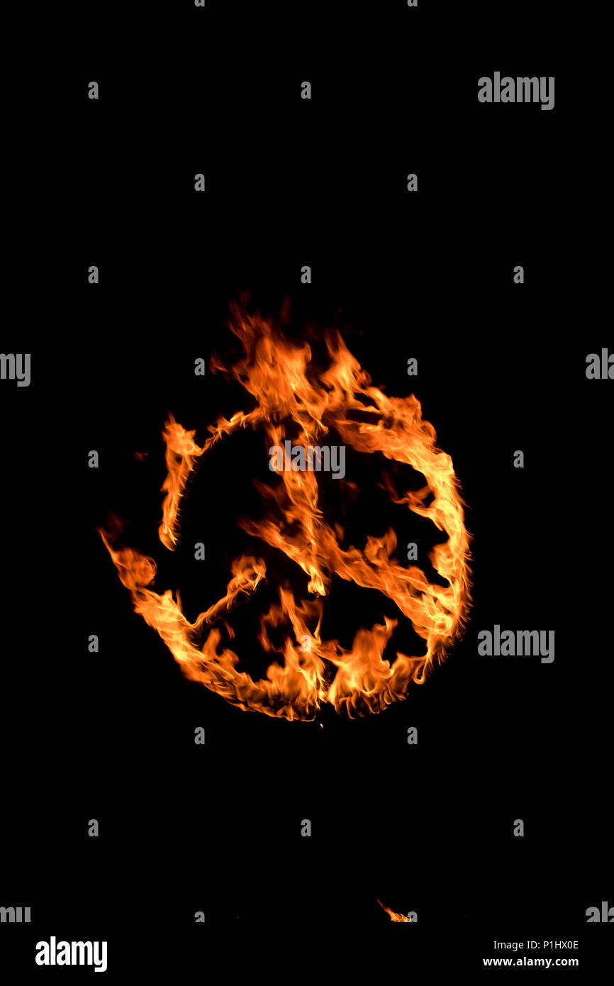 Burning peace symbol over black background Stock Photo - Alamy