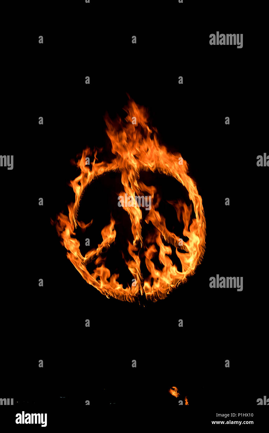 Burning peace symbol over black background Stock Photo - Alamy