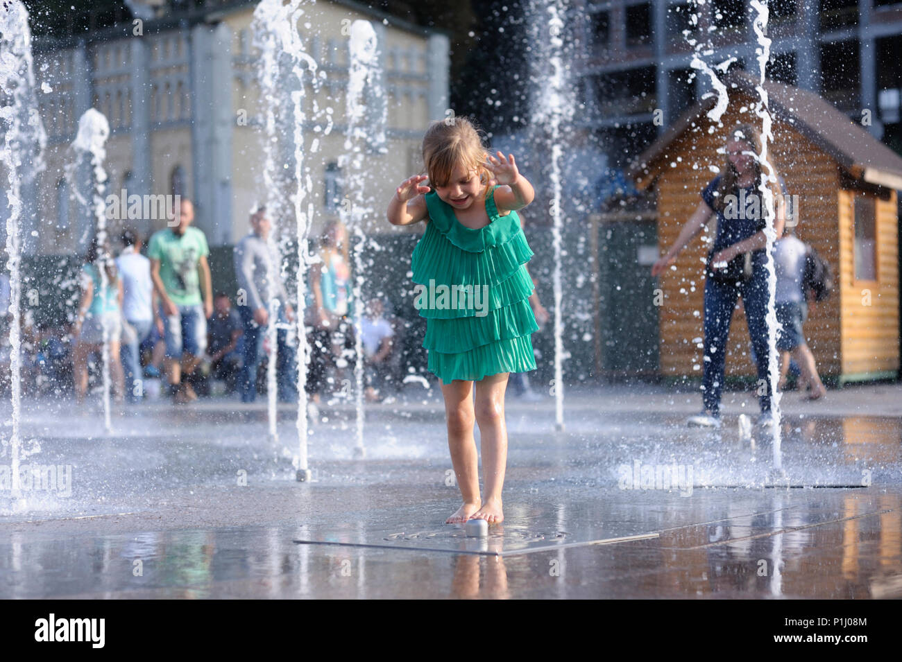 Girl Running Water Fountain High Resolution Stock Photography and ...