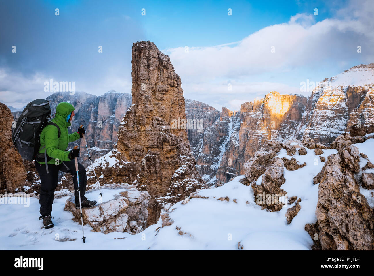 Tourist with backpack hiking in mountains Stock Photo - Alamy