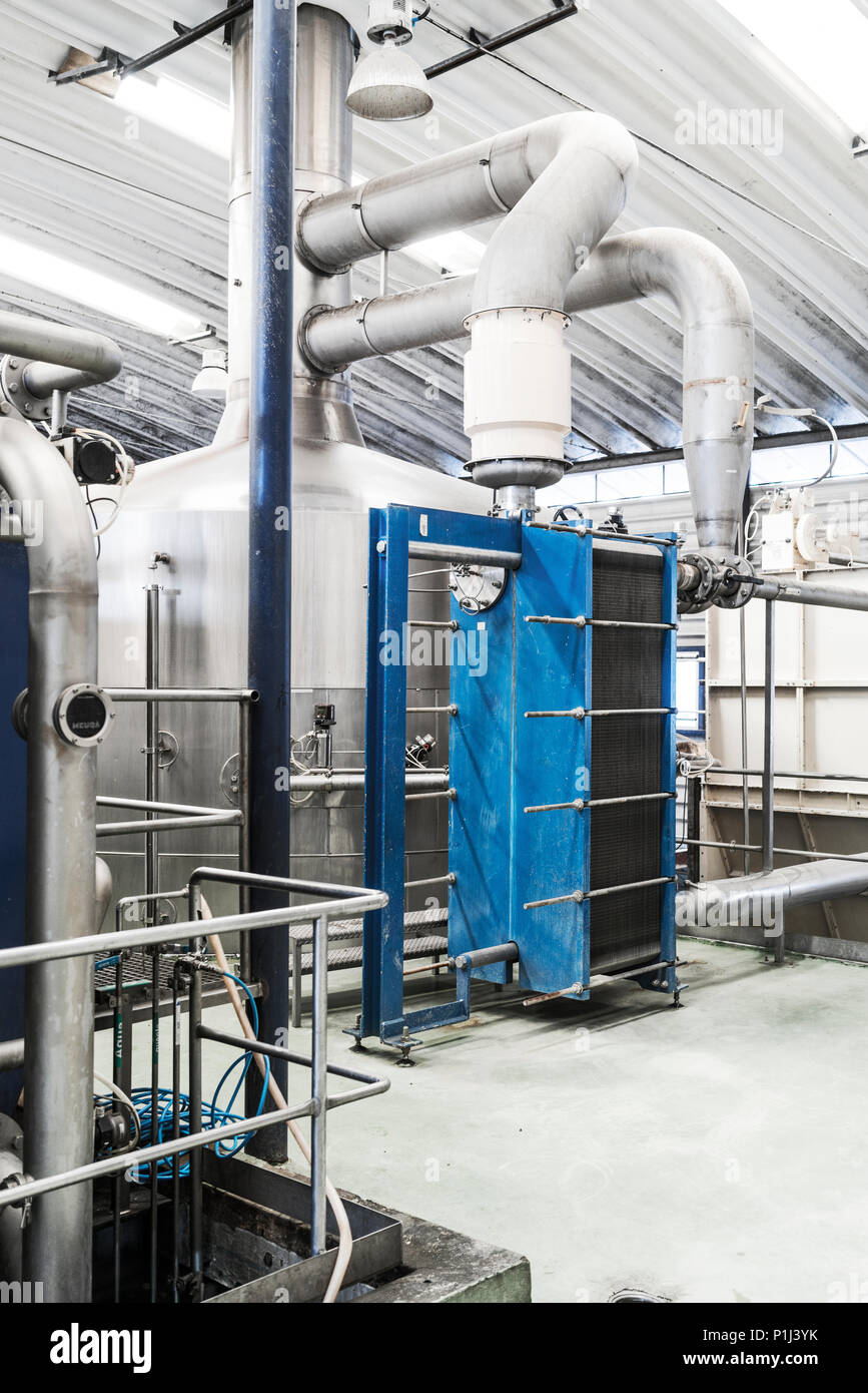 Indoor Beverage factory cylinders Stock Photo - Alamy