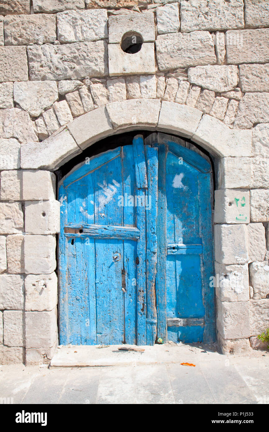 Wooden blue door in Madaba, Jordan Stock Photo - Alamy