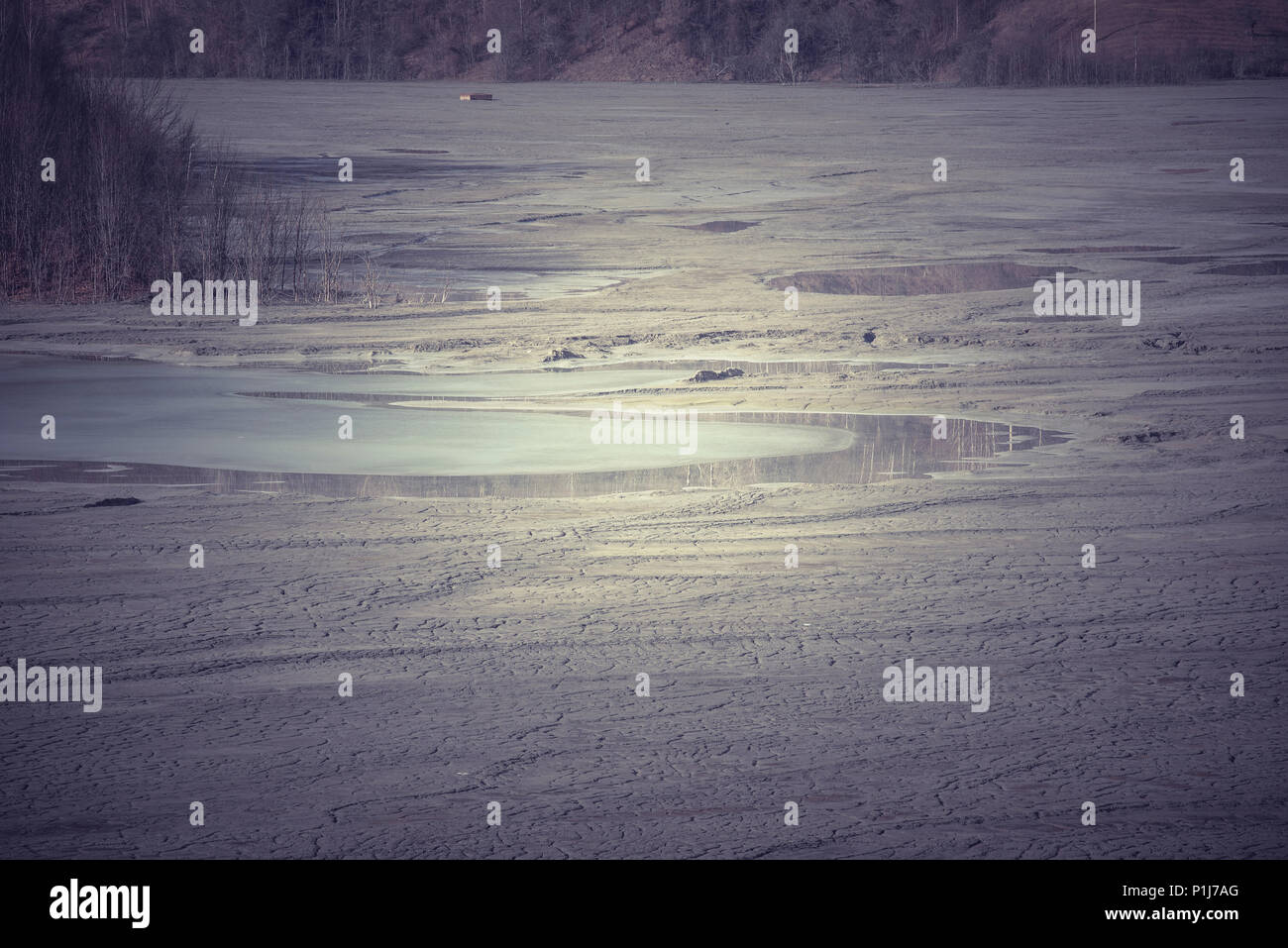 Cracked mud background. Waste soil contaminated with chemicals Stock ...