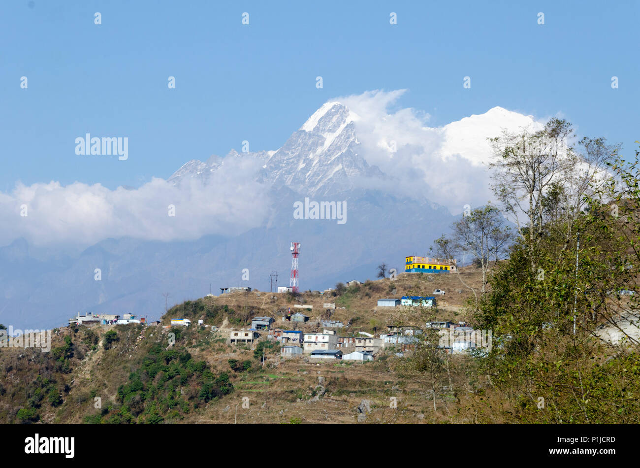 Snow capped mountains behind village, Dhunche, Nepal Stock Photo - Alamy