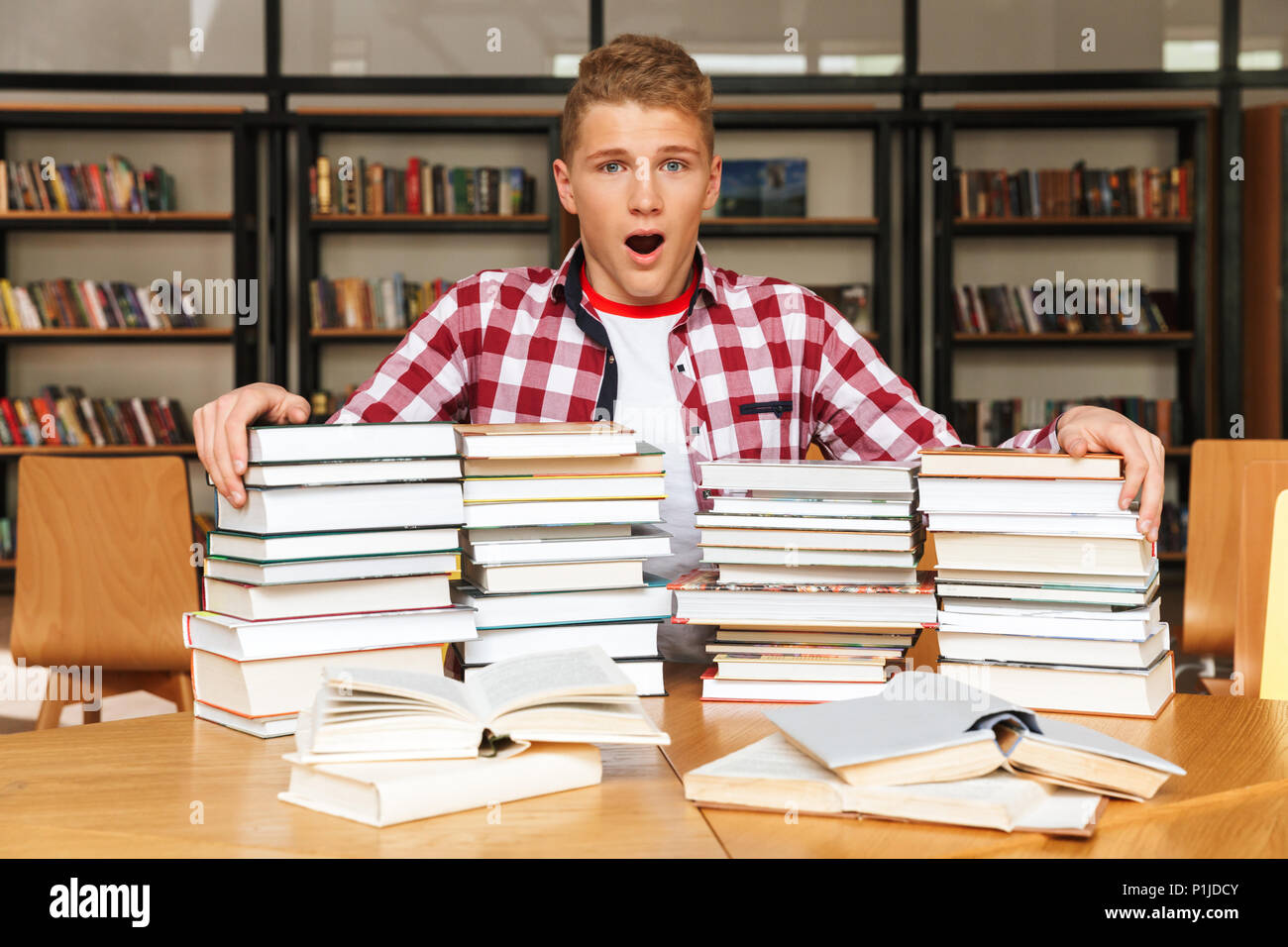 Man reading book shocked expression hi-res stock photography and images ...