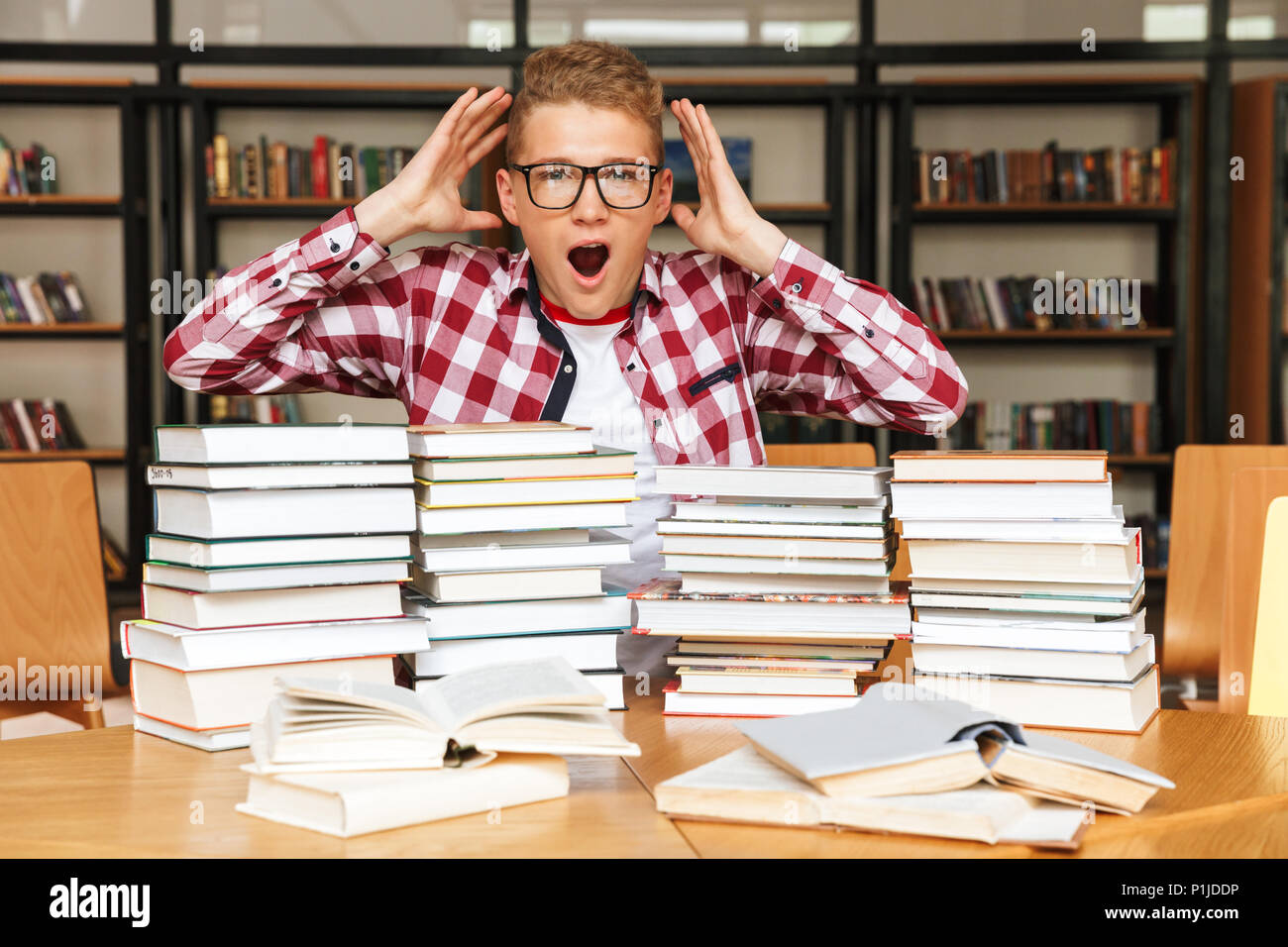 Man reading book shocked expression hi-res stock photography and images ...