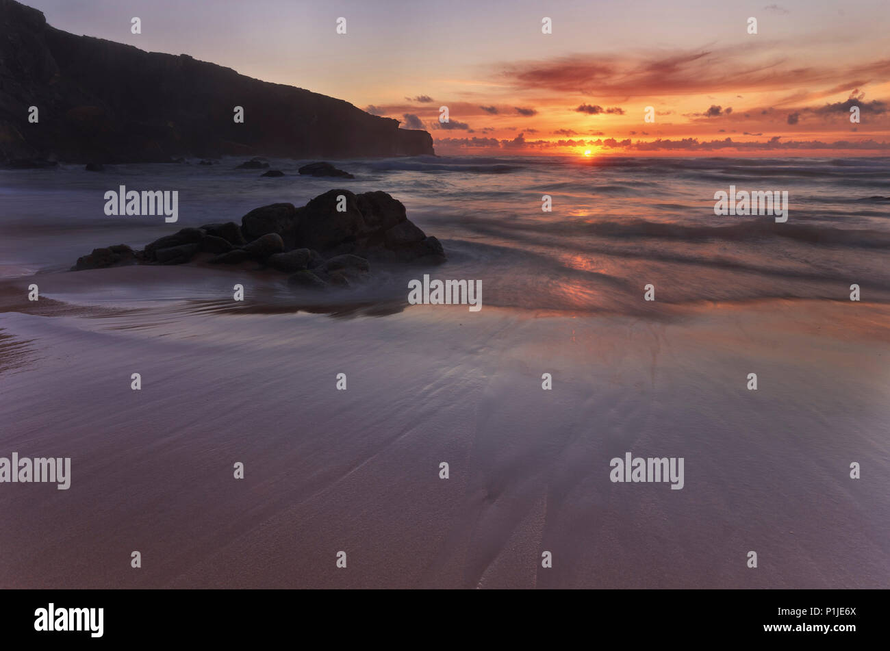 Sunset on Praia do Malhao beach, Vila Nova de Milfontes, Portugal Stock ...