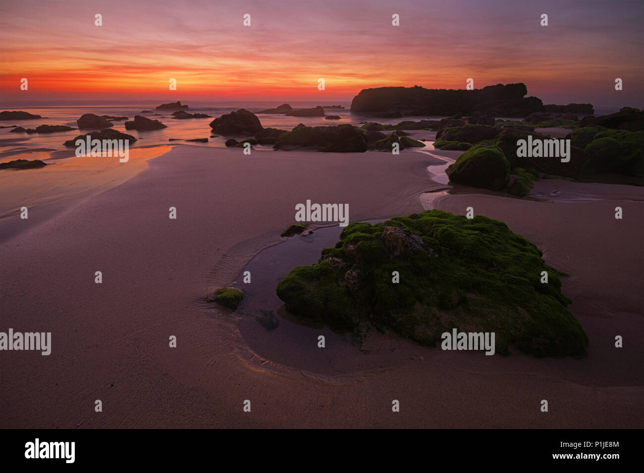 Sunset on Praia do Malhao beach, Vila Nova de Milfontes, Portugal Stock ...