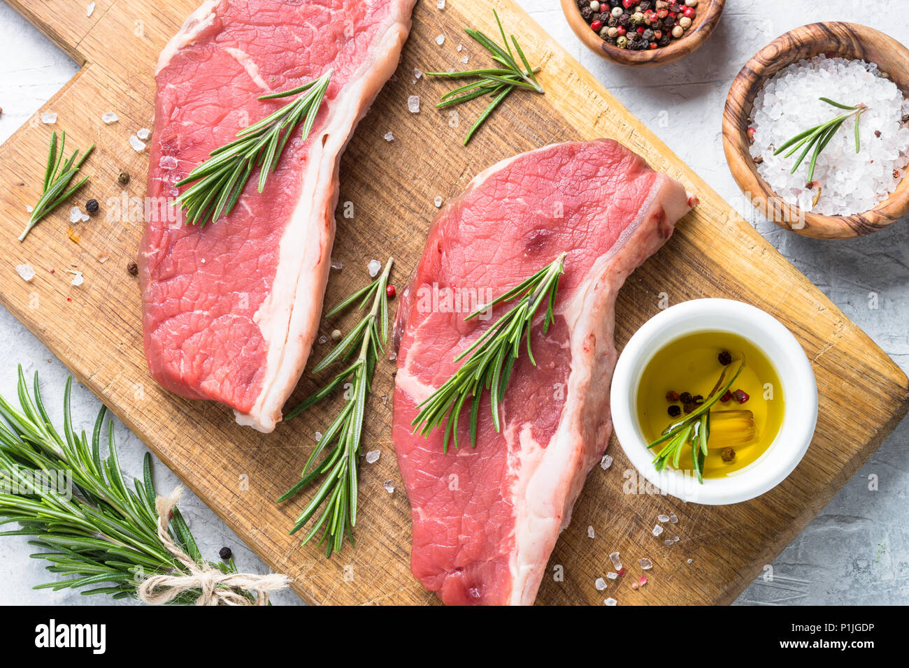 Raw beef striploin steak. Fresh meat ready to cooking. Top view copy ...