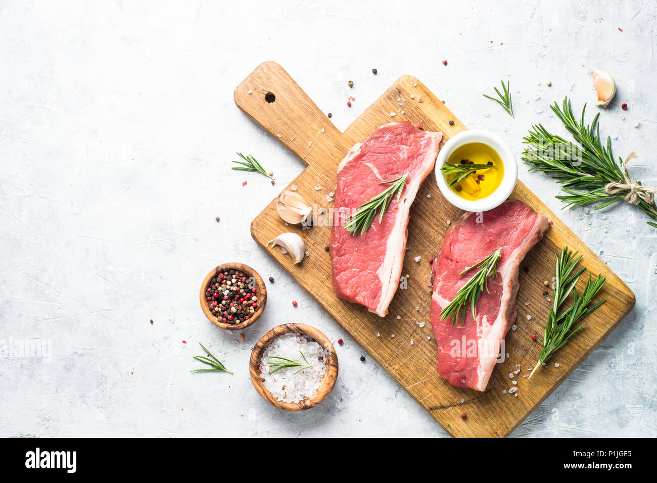 Raw beef striploin steak. Fresh meat ready to cooking. Top view copy ...