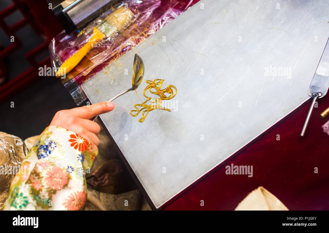 Asian man making candy hi-res stock photography and images - Alamy