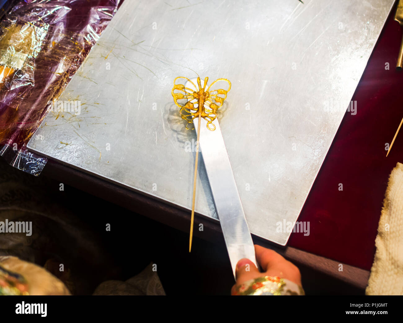 Person making a sugar candy painting top view Stock Photo - Alamy
