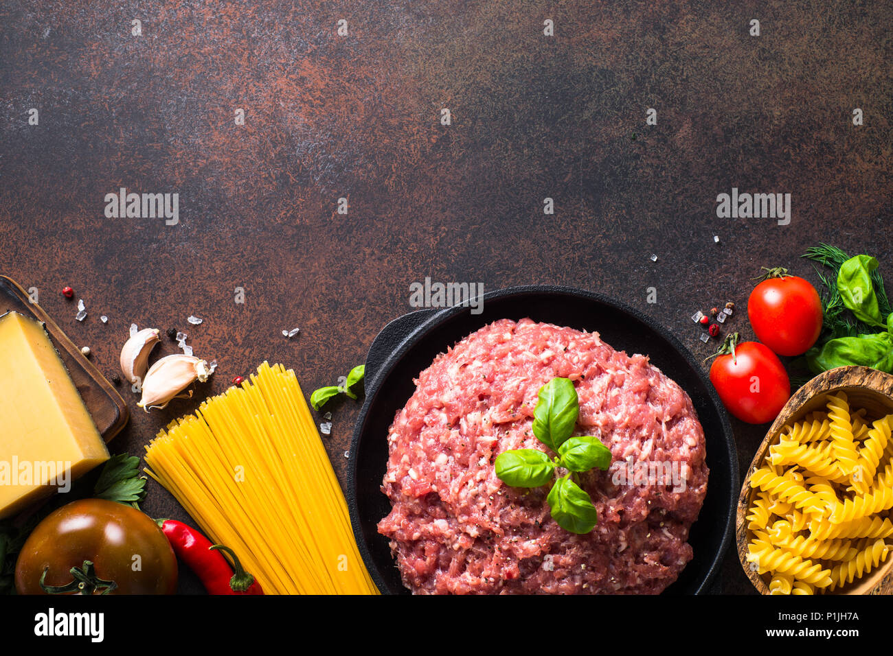 Minced meat, pasta and vegetables. Ingredients for cooking spaghetti ...
