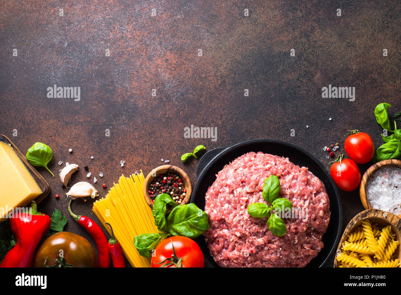 Minced meat, pasta and vegetables. Ingredients for cooking spaghetti ...