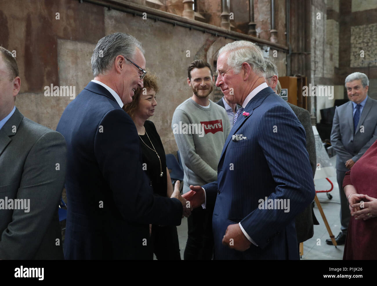 The Prince of Wales shakes hands with Sinn Fein MLA Gerry Kelly at ...