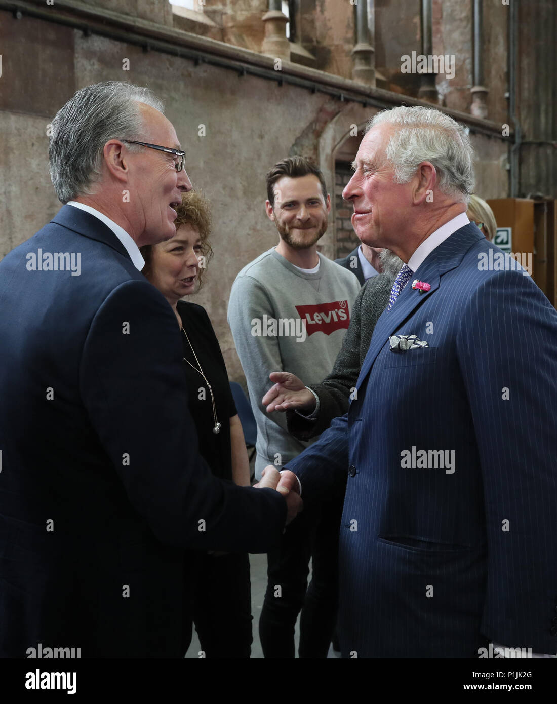 The Prince of Wales shakes hands with Sinn Fein MLA Gerry Kelly at ...
