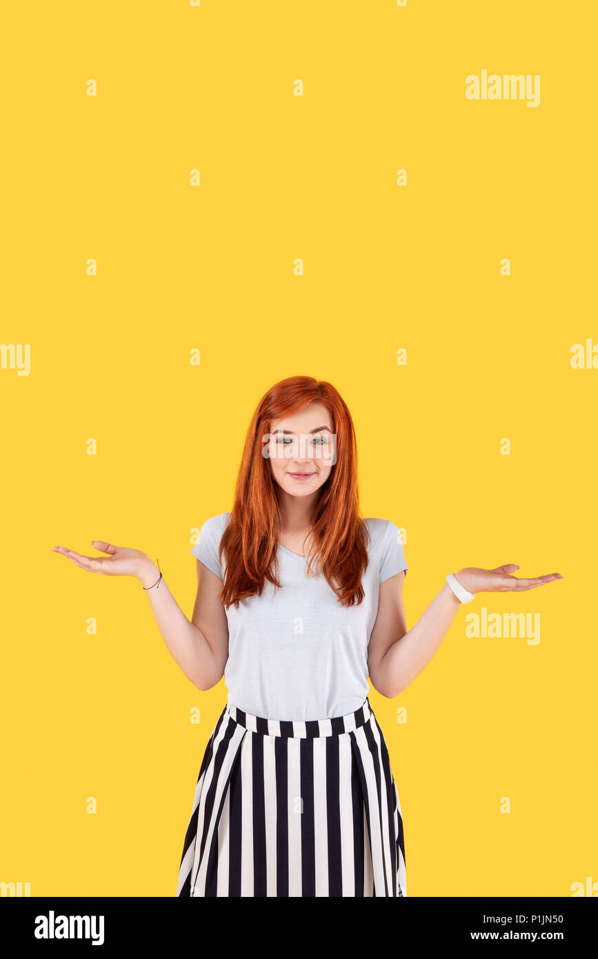 Happy attractive woman holding her hands up Stock Photo - Alamy