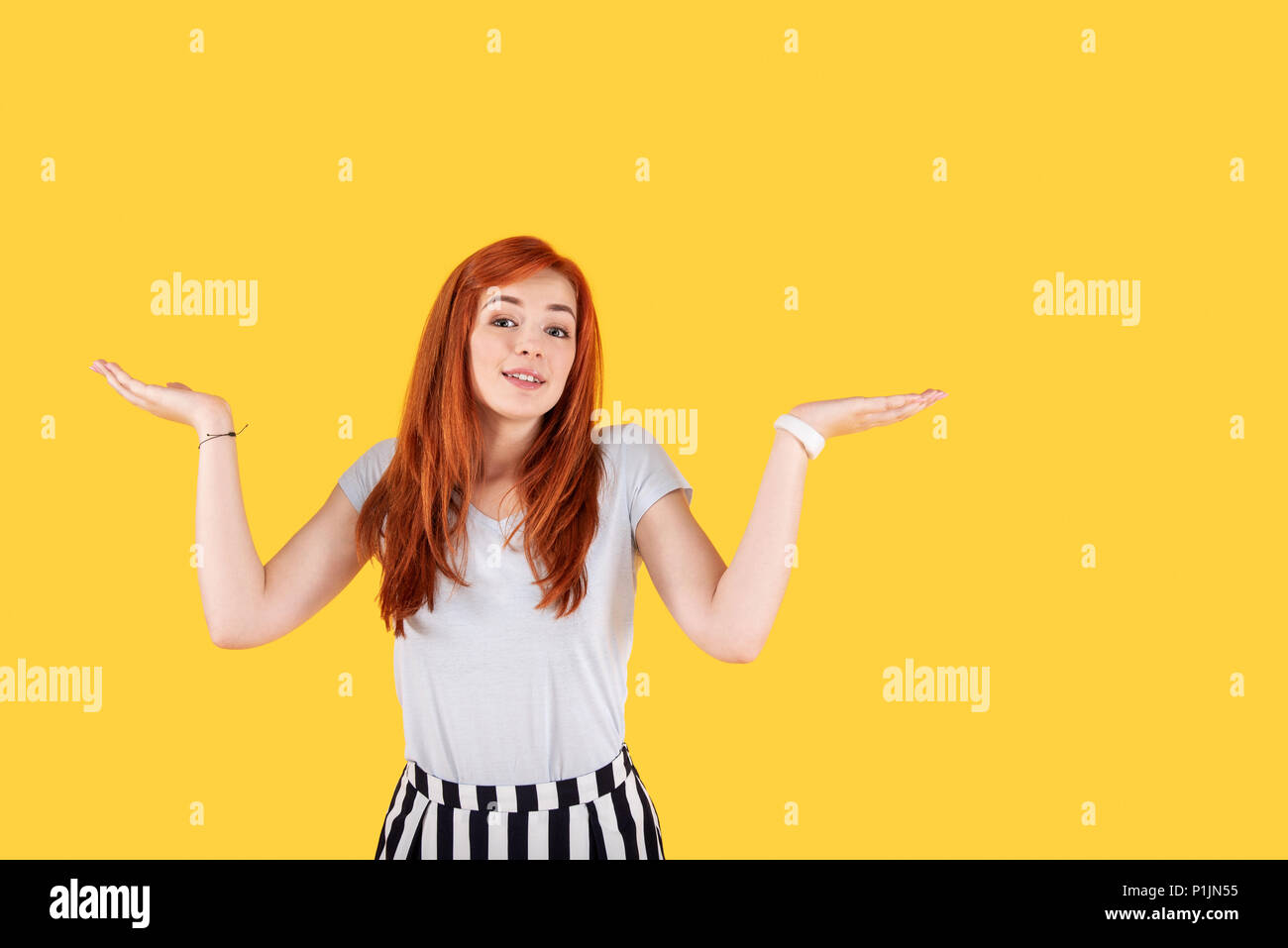 Shrugging pose hi-res stock photography and images - Alamy