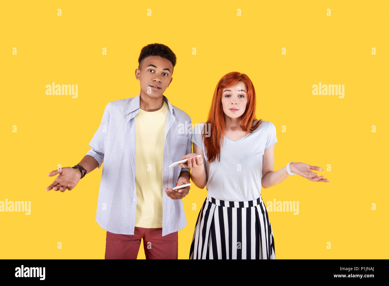 Shrugging pose hi-res stock photography and images - Alamy