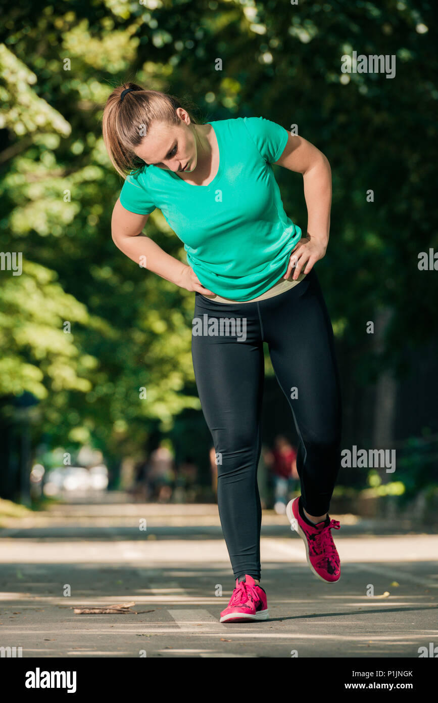 Fitness woman jogging on the running track into the park Stock Photo ...