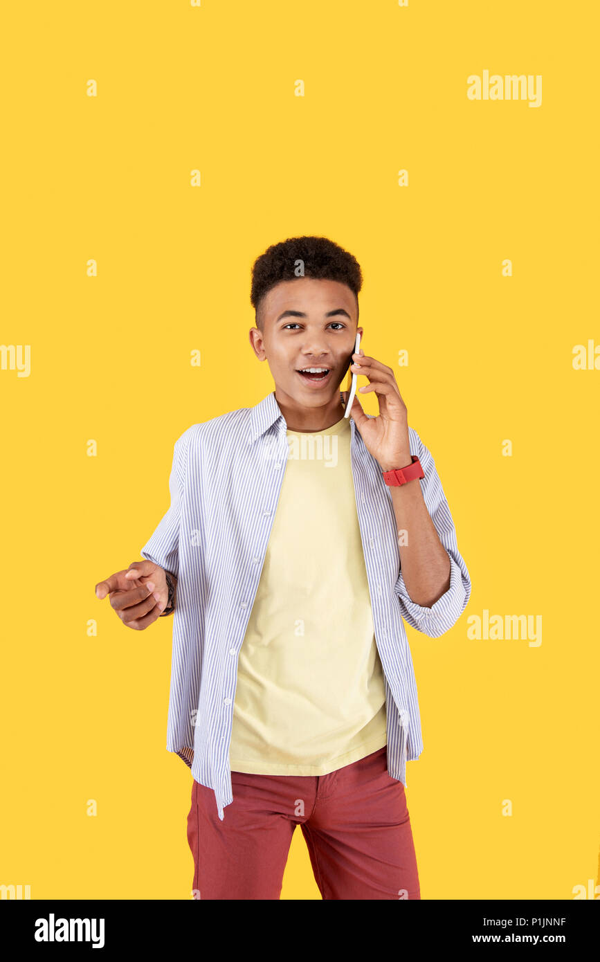 Cheerful delighted man smiling Stock Photo - Alamy