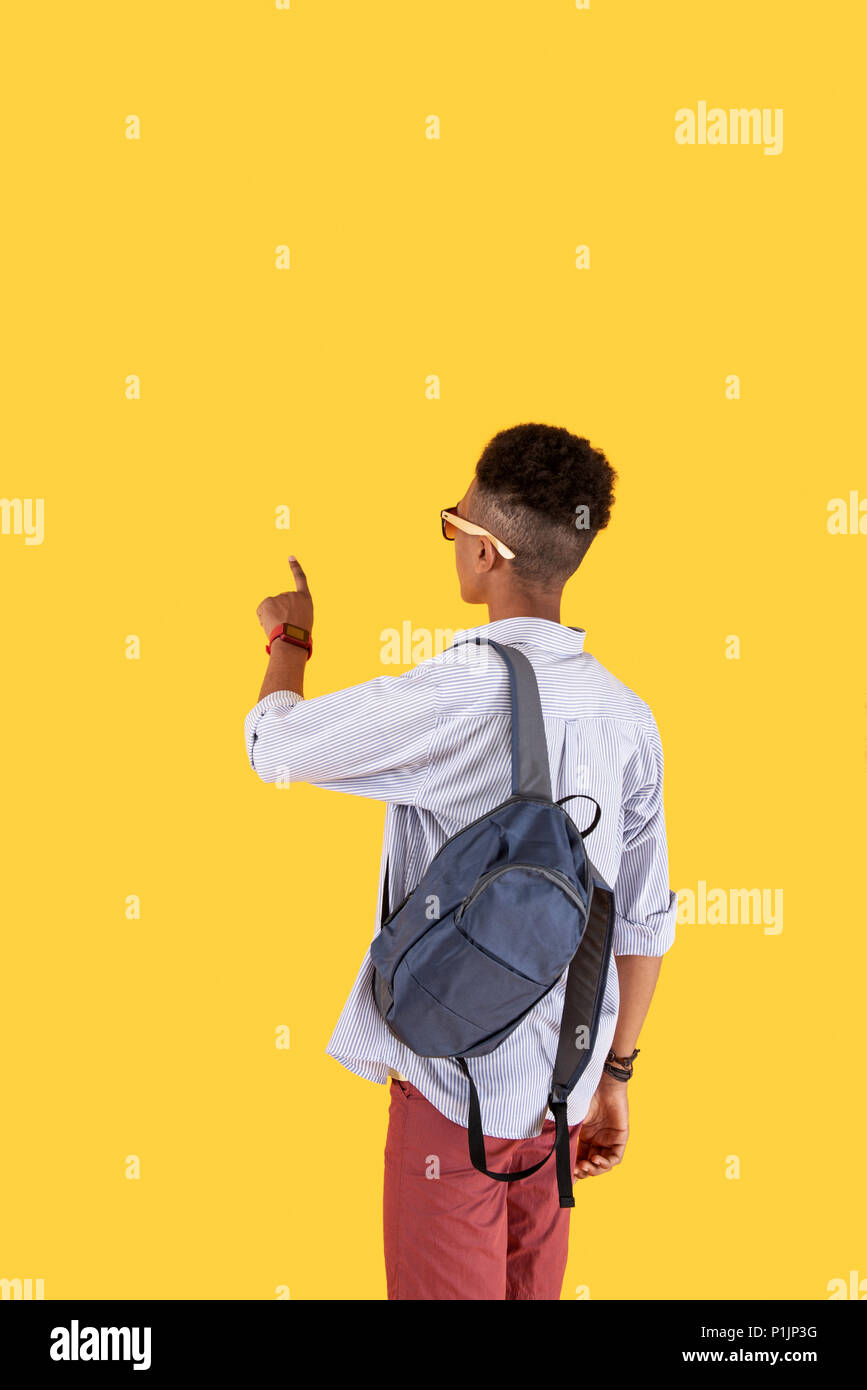 Nice young man pressing the bell Stock Photo - Alamy