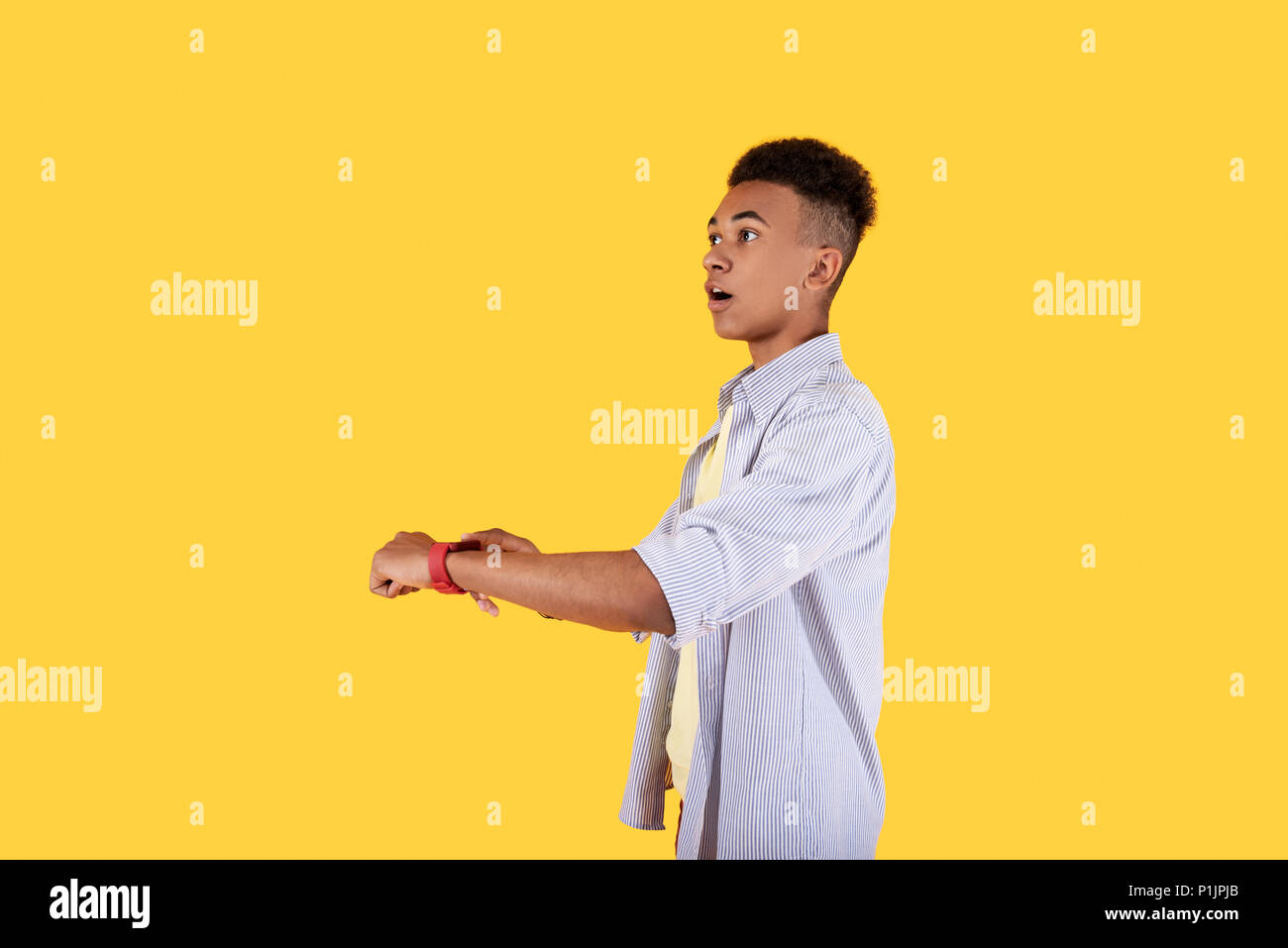 Nice young man being surprised Stock Photo - Alamy