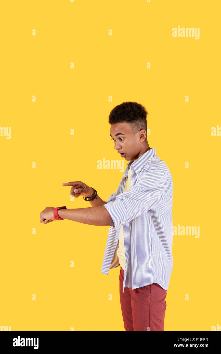 Excited young man using new technology Stock Photo - Alamy