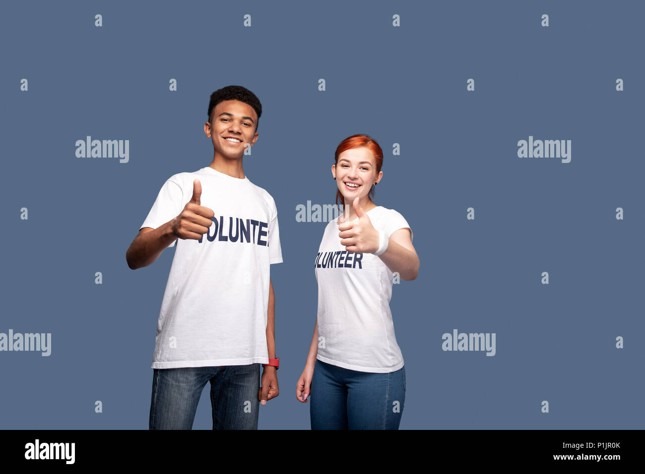 Positive young couple volunteering together Stock Photo - Alamy