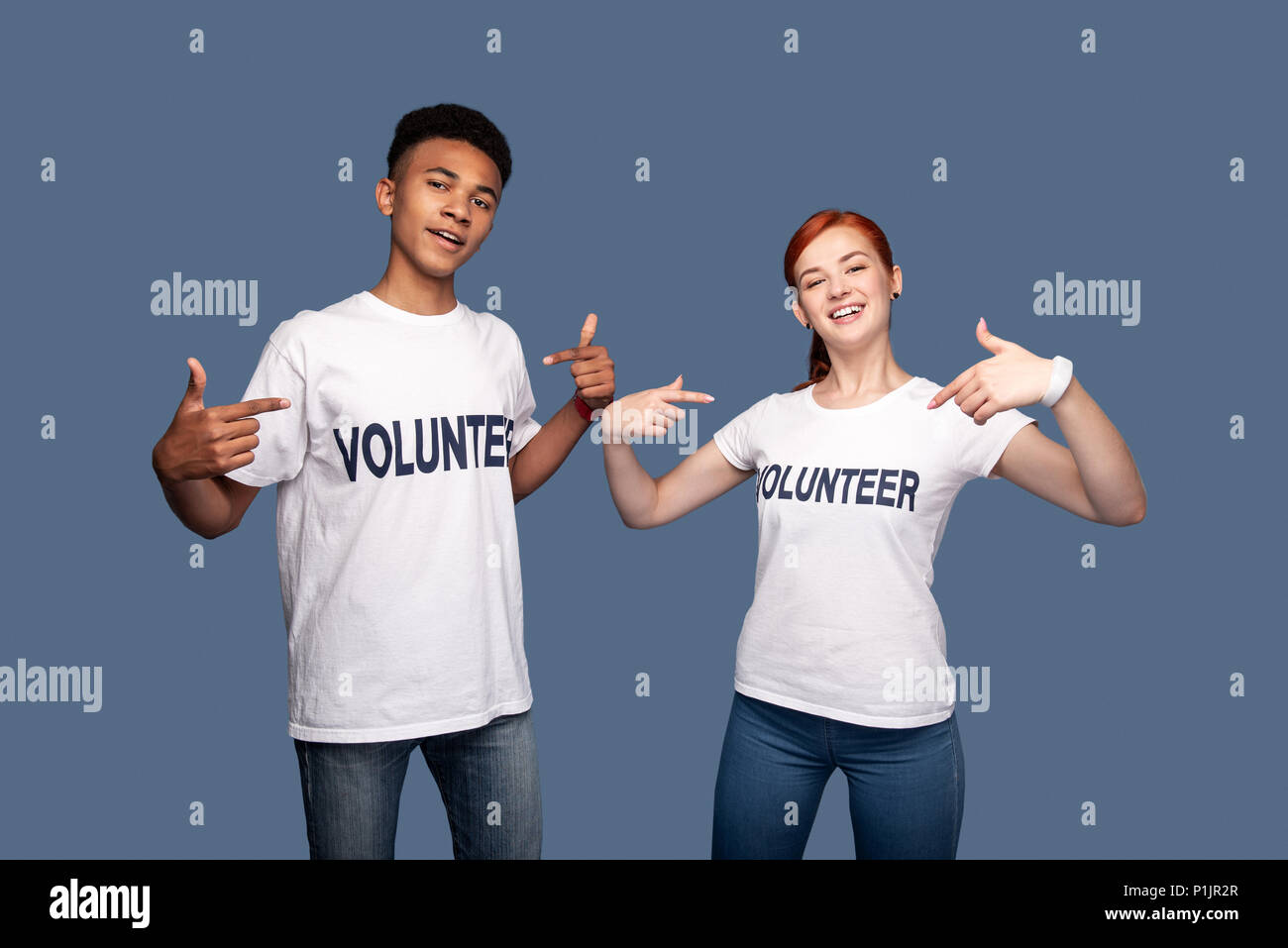 Happy nice people pointing at themselves Stock Photo - Alamy