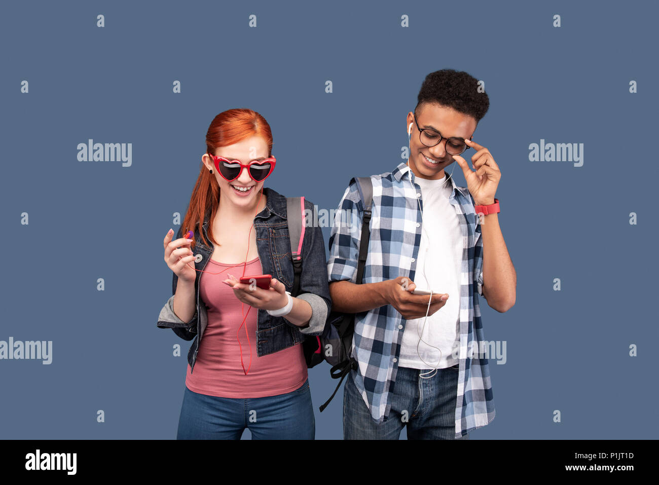 Joyful positive people using headphones Stock Photo - Alamy