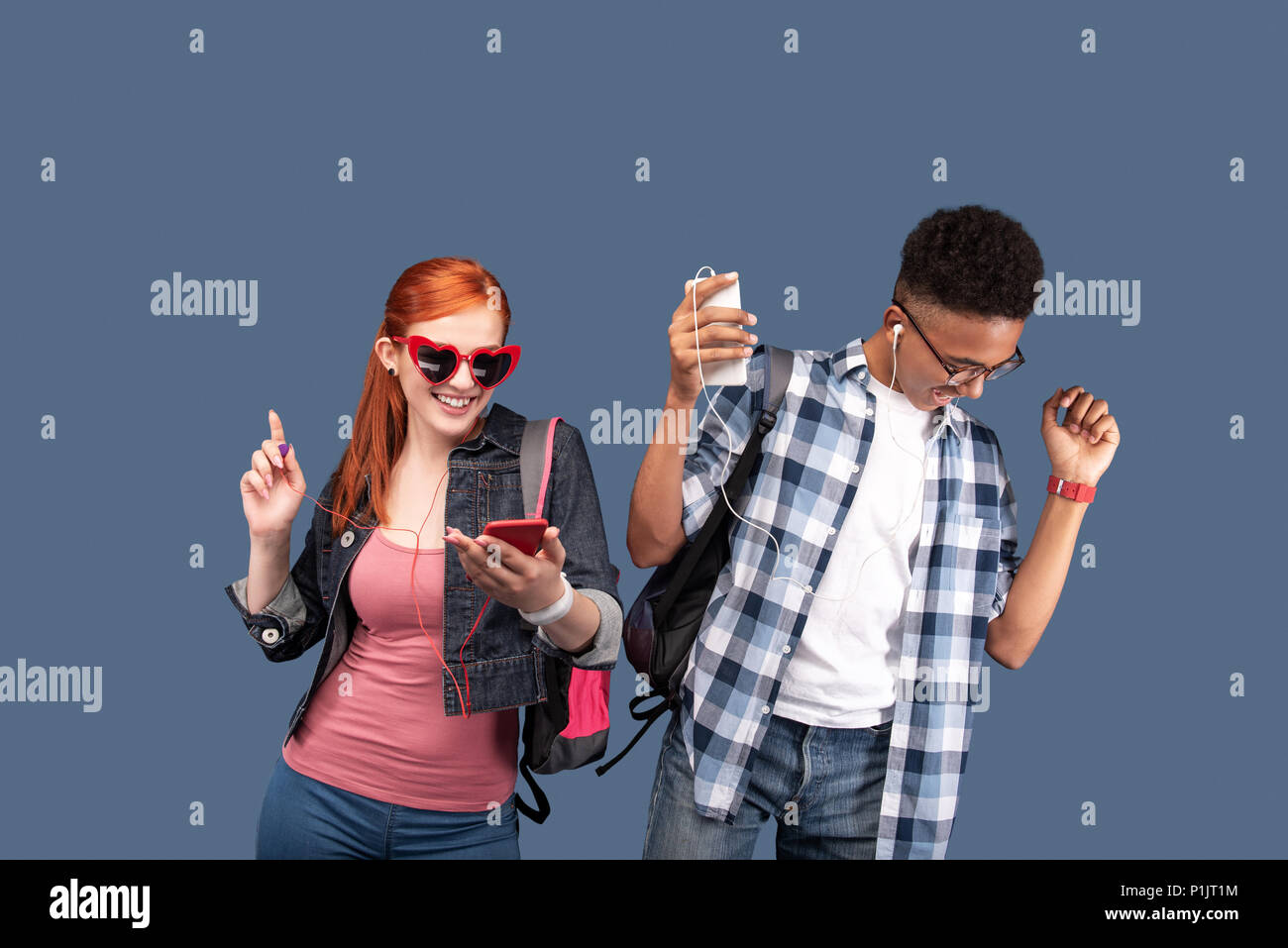 Couple having fun listening music hi-res stock photography and images ...