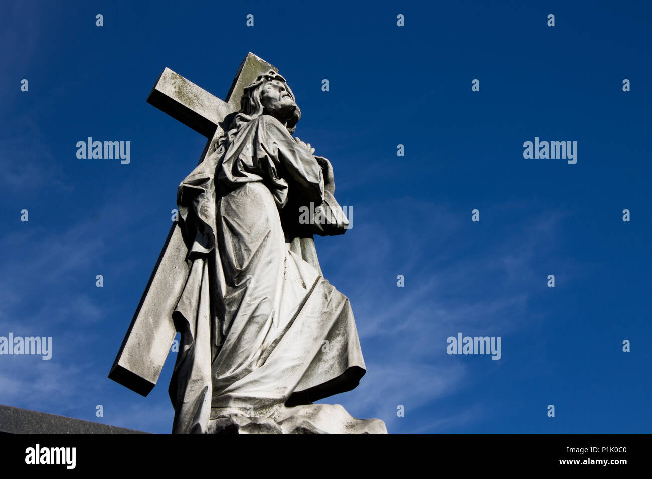 The burden of the cross depicted in a statue at the Recoleta Cemetery ...