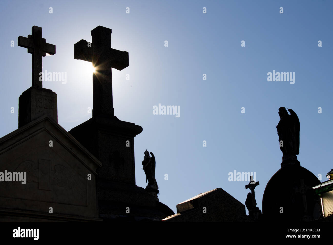Mausolea silhouetted against the afternoon sky at Recoleta Cemetery in ...