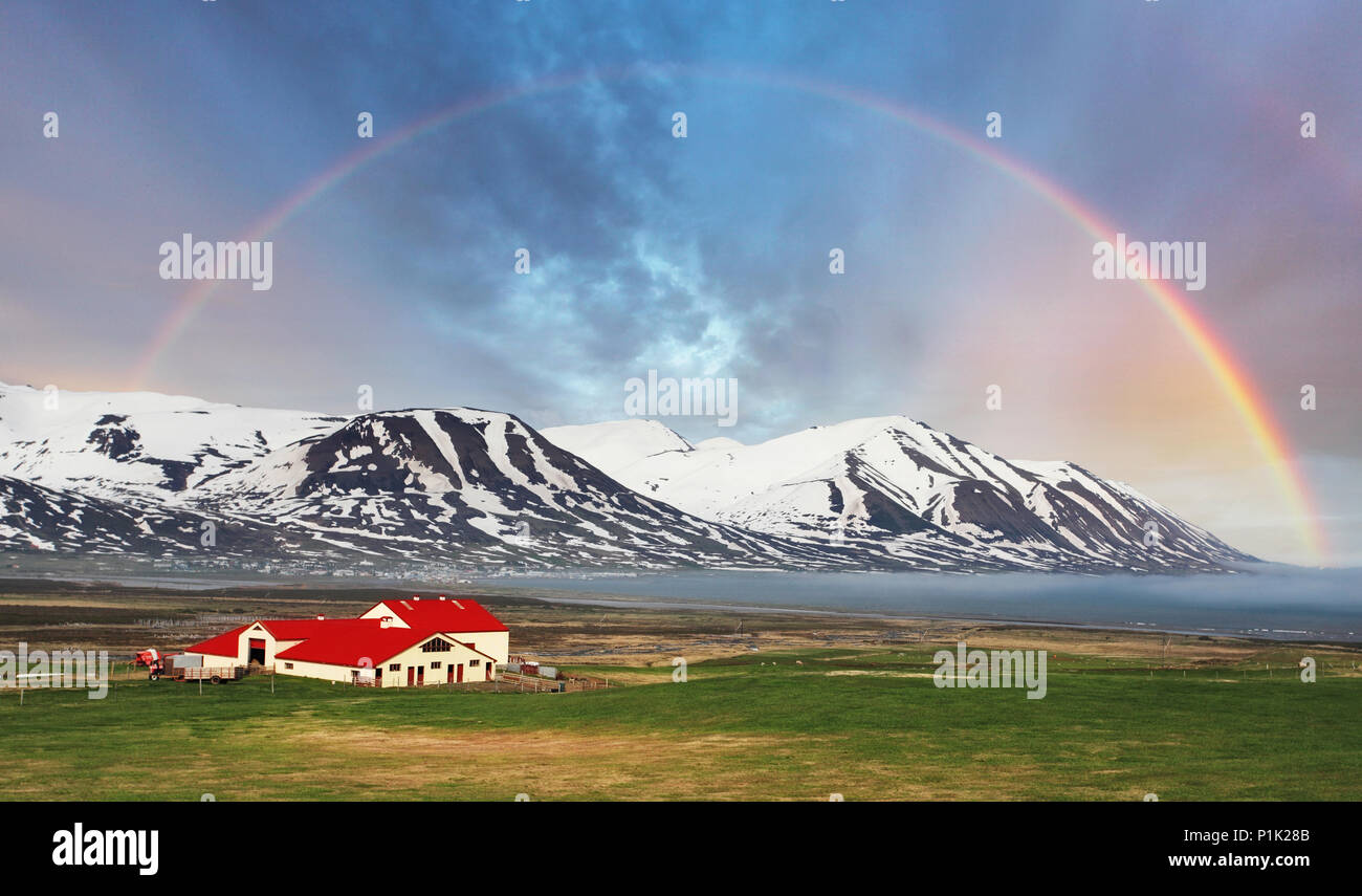 Iceland landspace mountain with rainbow Stock Photo - Alamy