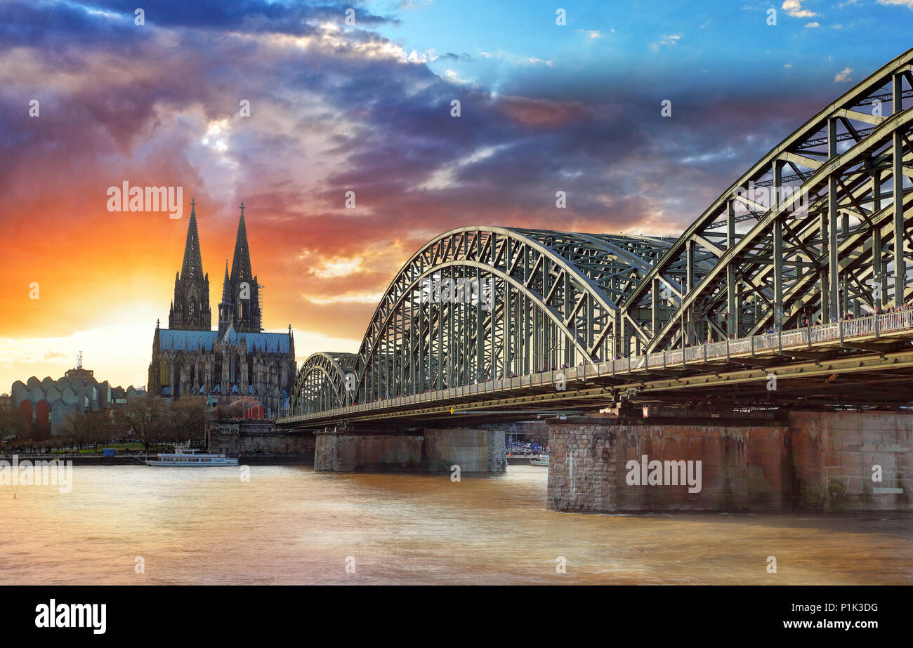Cologne Cathedral and Hohenzollern Bridge at sunset - night Stock Photo ...