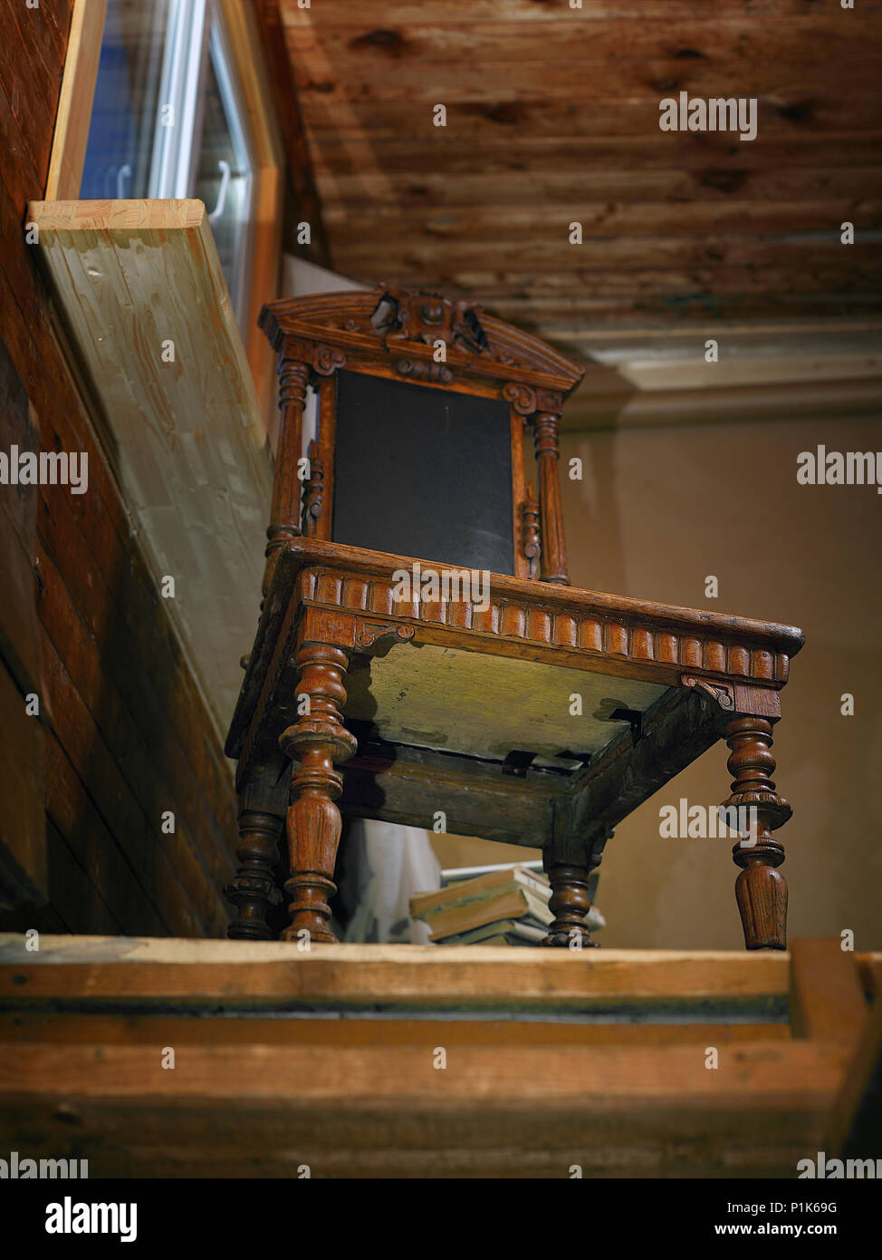 Vertical low angle shot of a woodn house interior with vintage chair ...