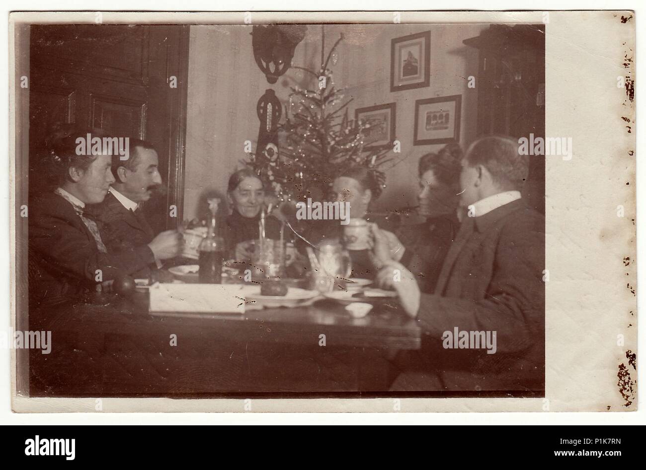 GERMANY - CIRCA 1940s: Vintage photo shows family sits at the table ...
