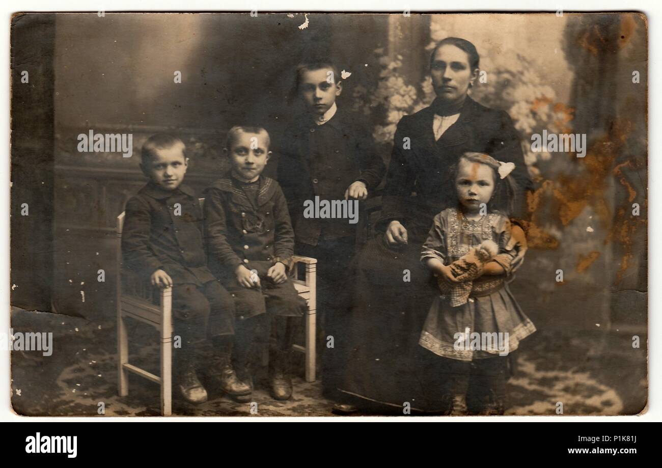 PRAGUE, AUSTRIA-HUNGARY - CIRCA 1915: Vintage photo shows mother with ...